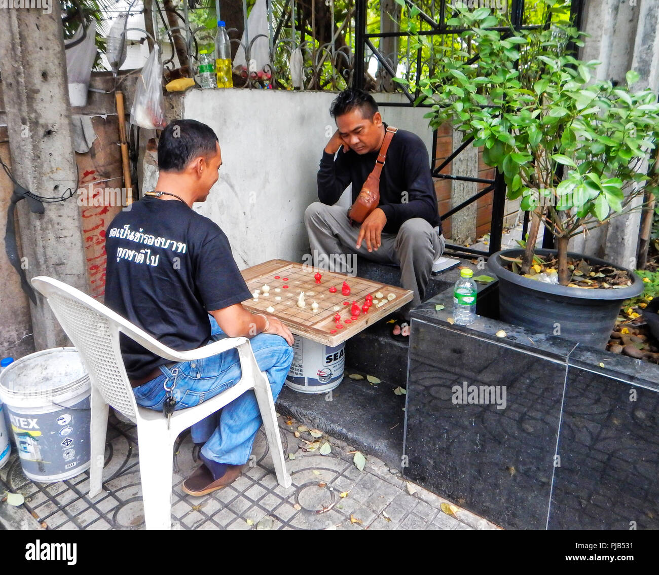 Two thai men playing board game hi-res stock photography and images - Alamy
