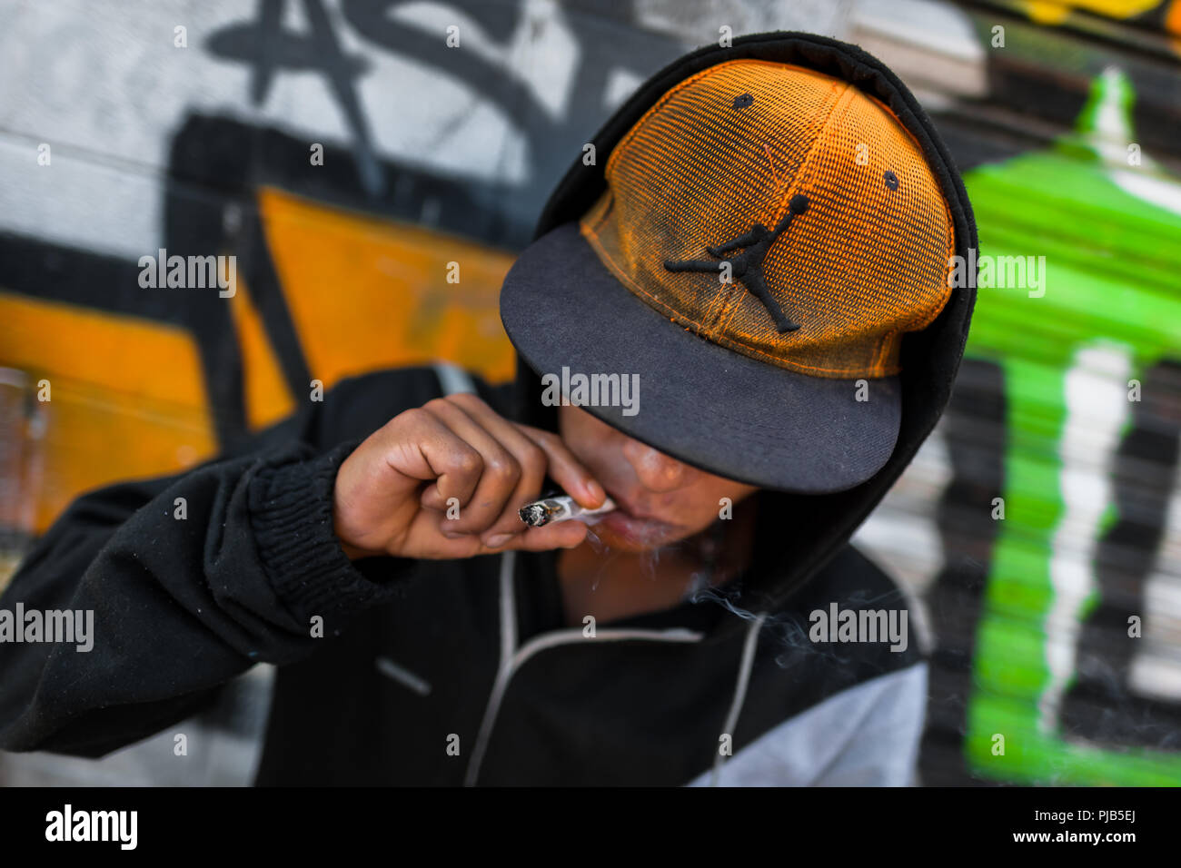 A Mexican follower of Santa Muerte (Holy Death) smokes a marijuana ...
