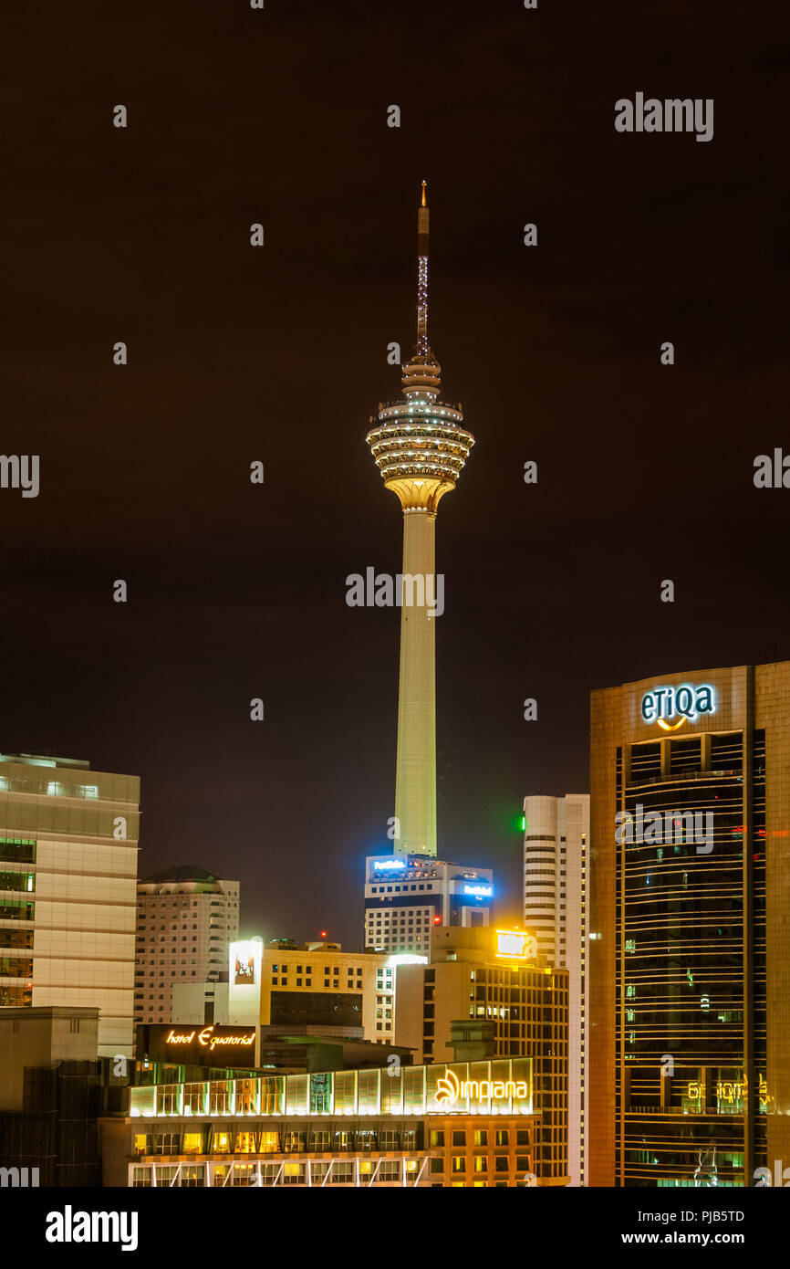 Great view of the illuminated Menara KL Tower at night, one of Malaysia ...