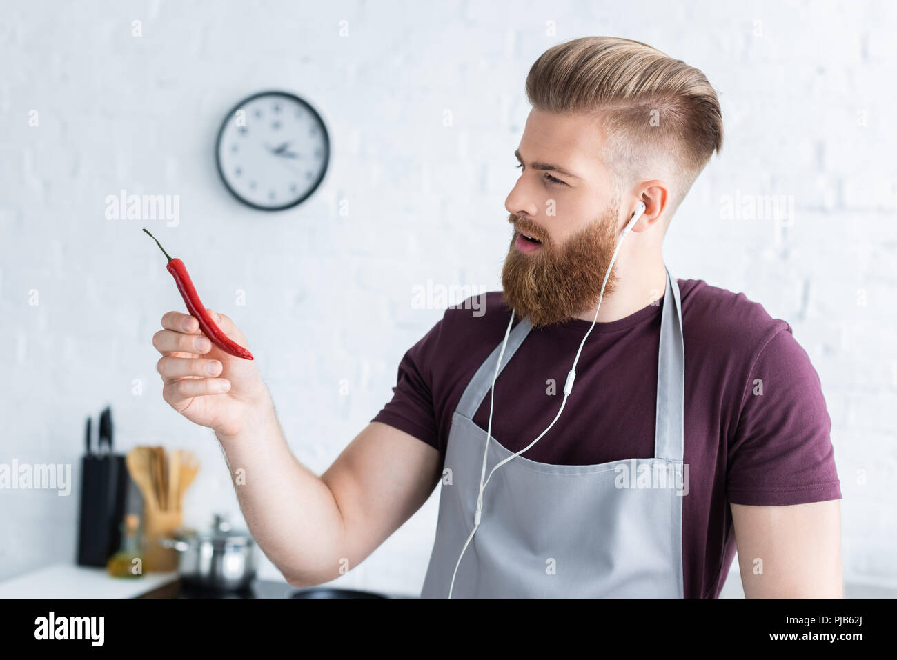 Man eating chili pepper hi-res stock photography and images - Alamy