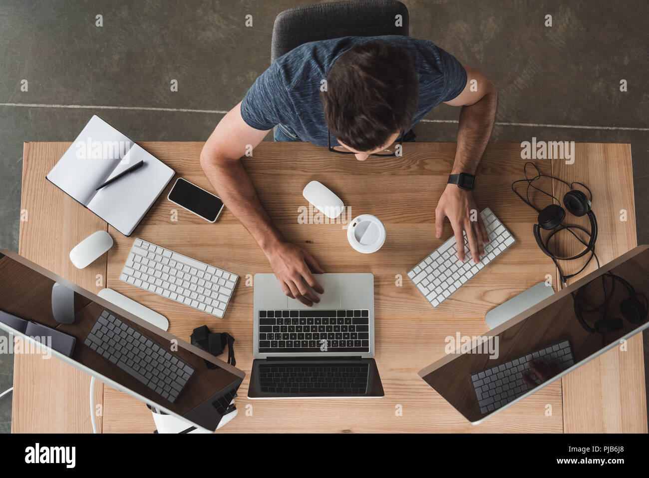 overhead view of programmer using computers at workplace Stock Photo ...