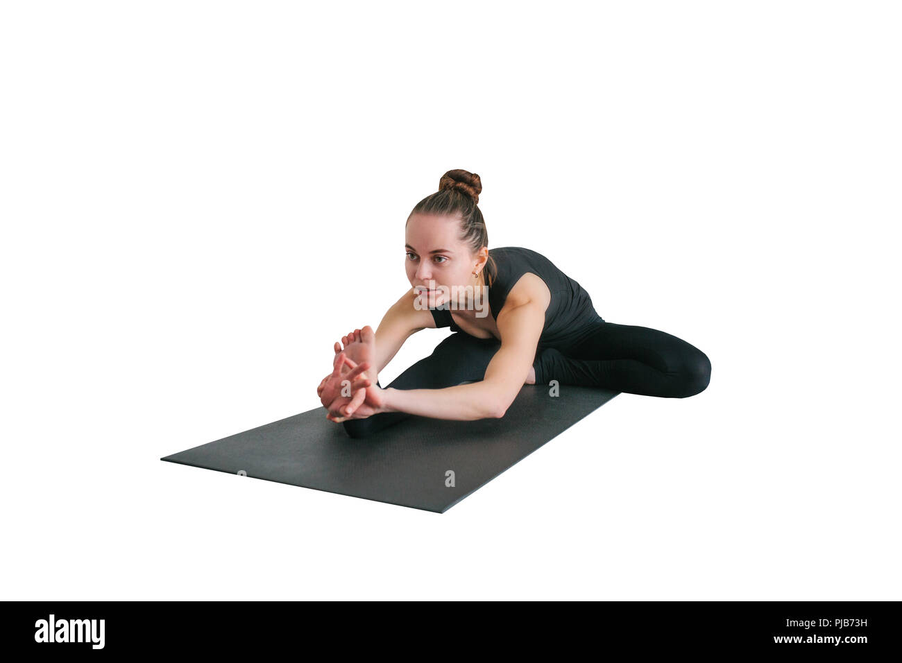 Girl doing yoga isolated on white background Stock Photo - Alamy