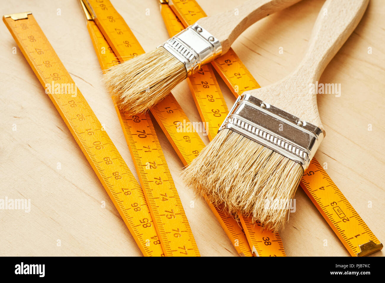 background with a ruler and brush for painting on a wooden board Stock ...