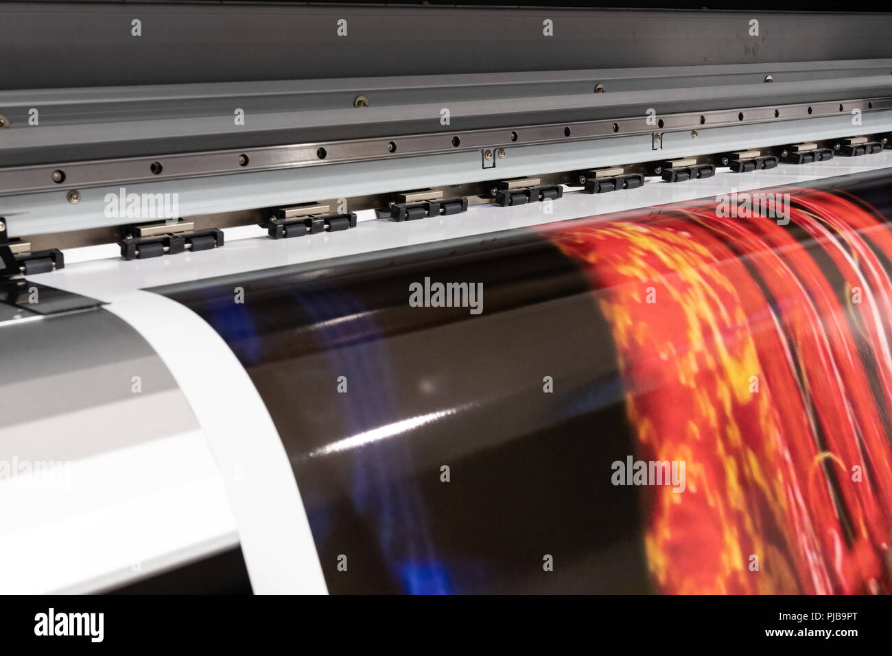 Big professional printer, processing large scale vinyl rolls for color ...