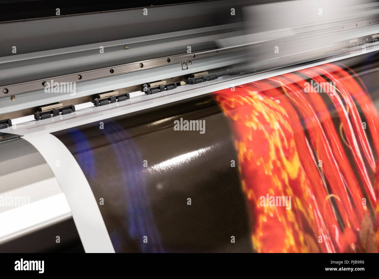 Big professional printer, processing large scale vinyl rolls for color ...