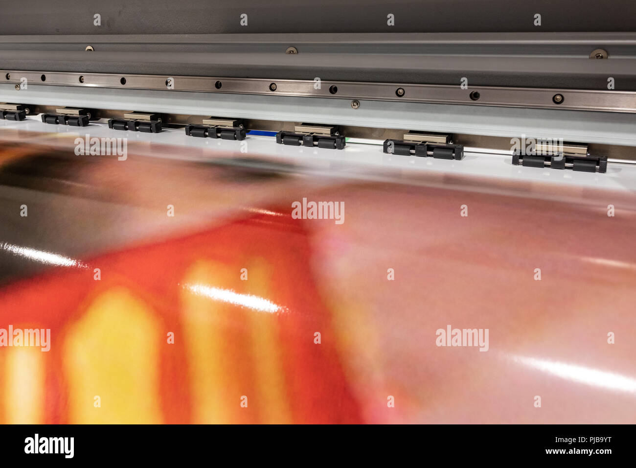 Big professional printer, processing large scale vinyl rolls for color ...