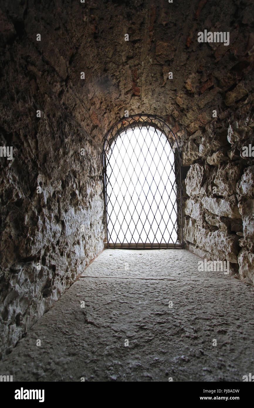 Small arch window in medieval stone church Stock Photo - Alamy