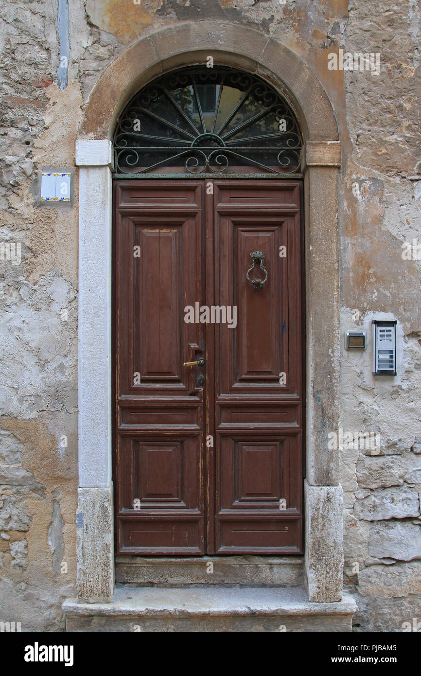 Medieval arch wooden door at old house Stock Photo - Alamy