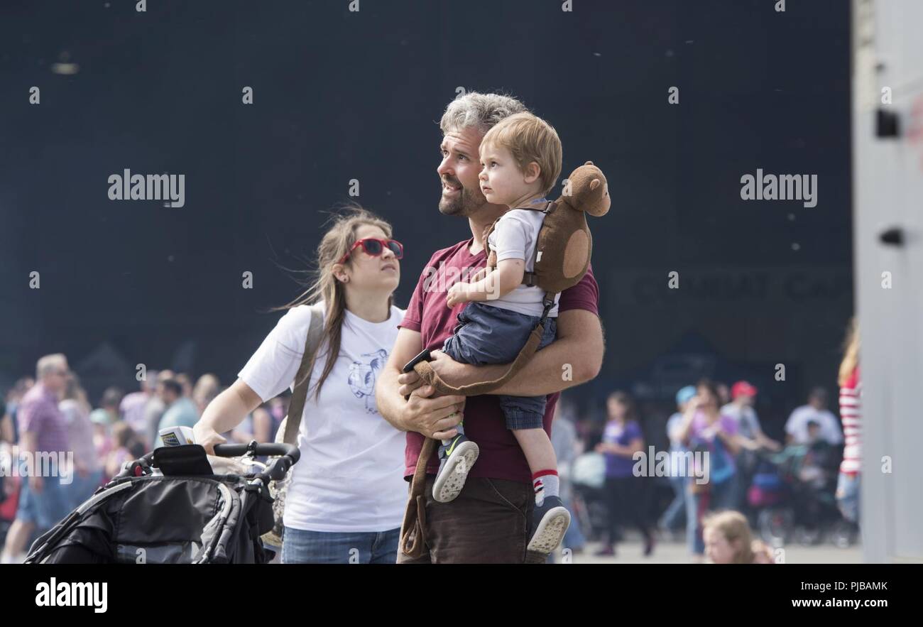 Ezekiel, 2, son of Diamond and Jocelyn Redmond, looks at a static ...