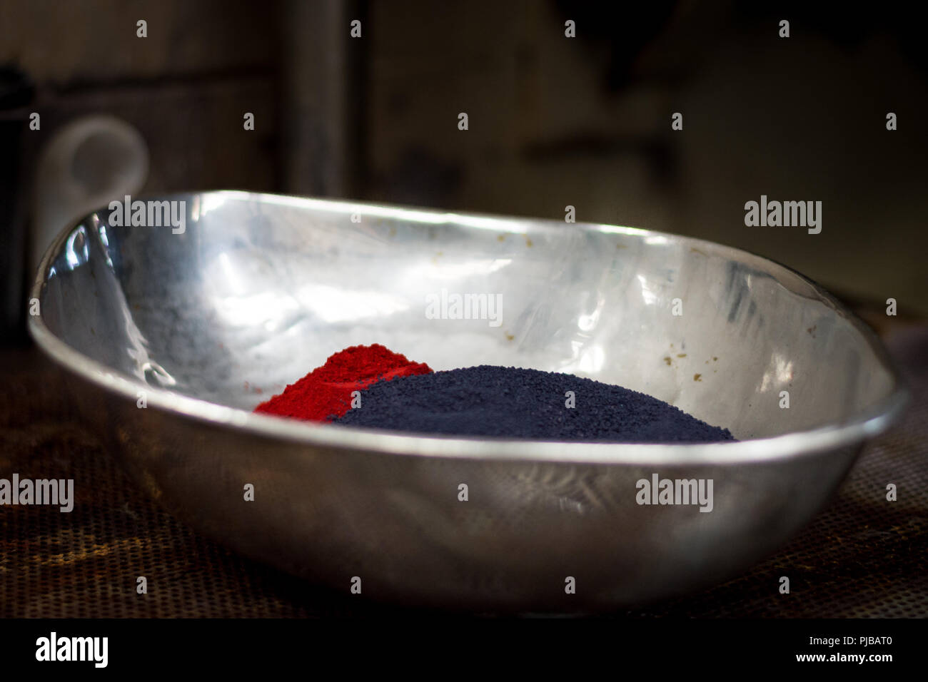 red and blue pigment dyes in a stainless steel weigh pan Stock Photo ...