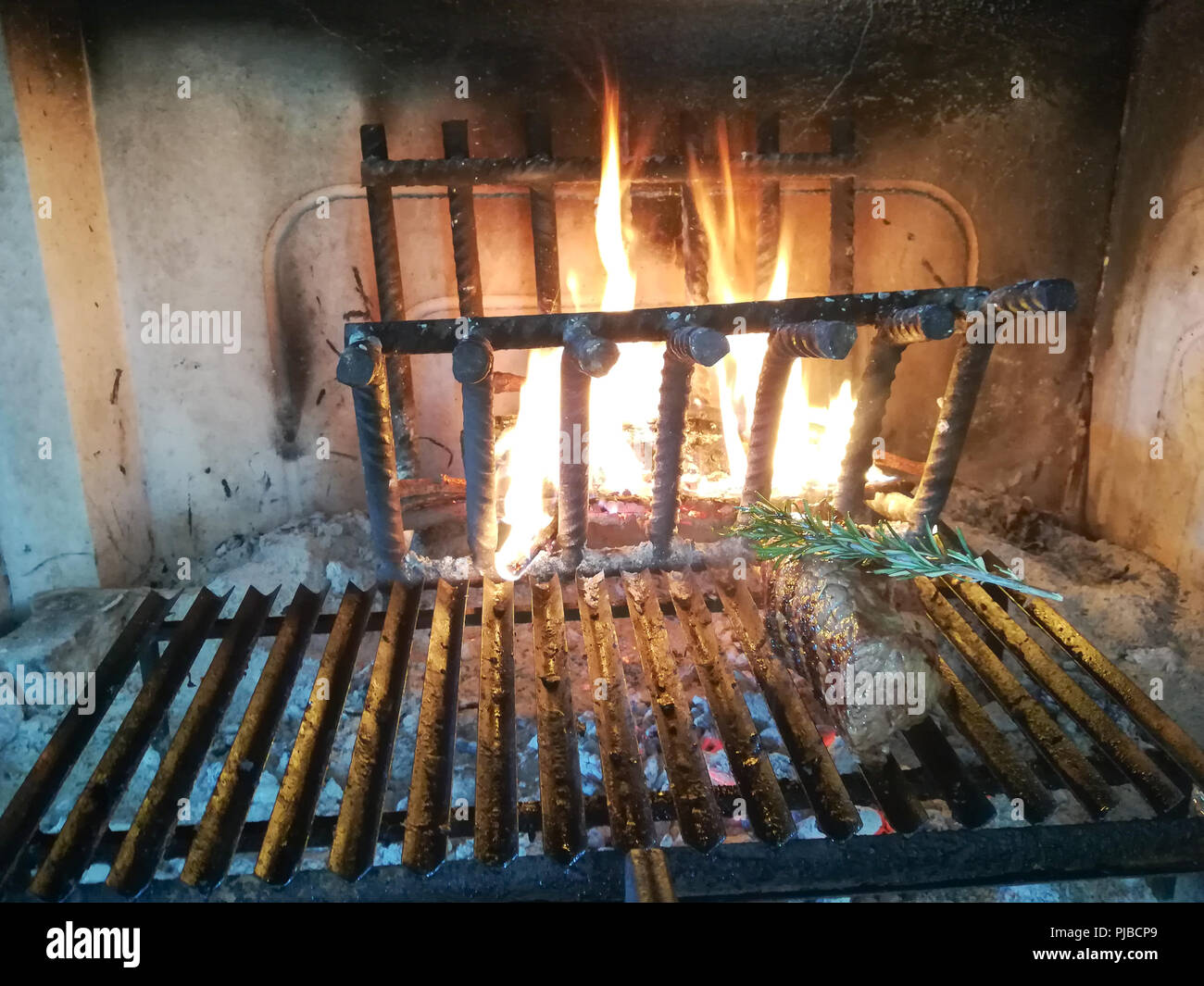Grilled meat cooked on fireplace Stock Photo - Alamy