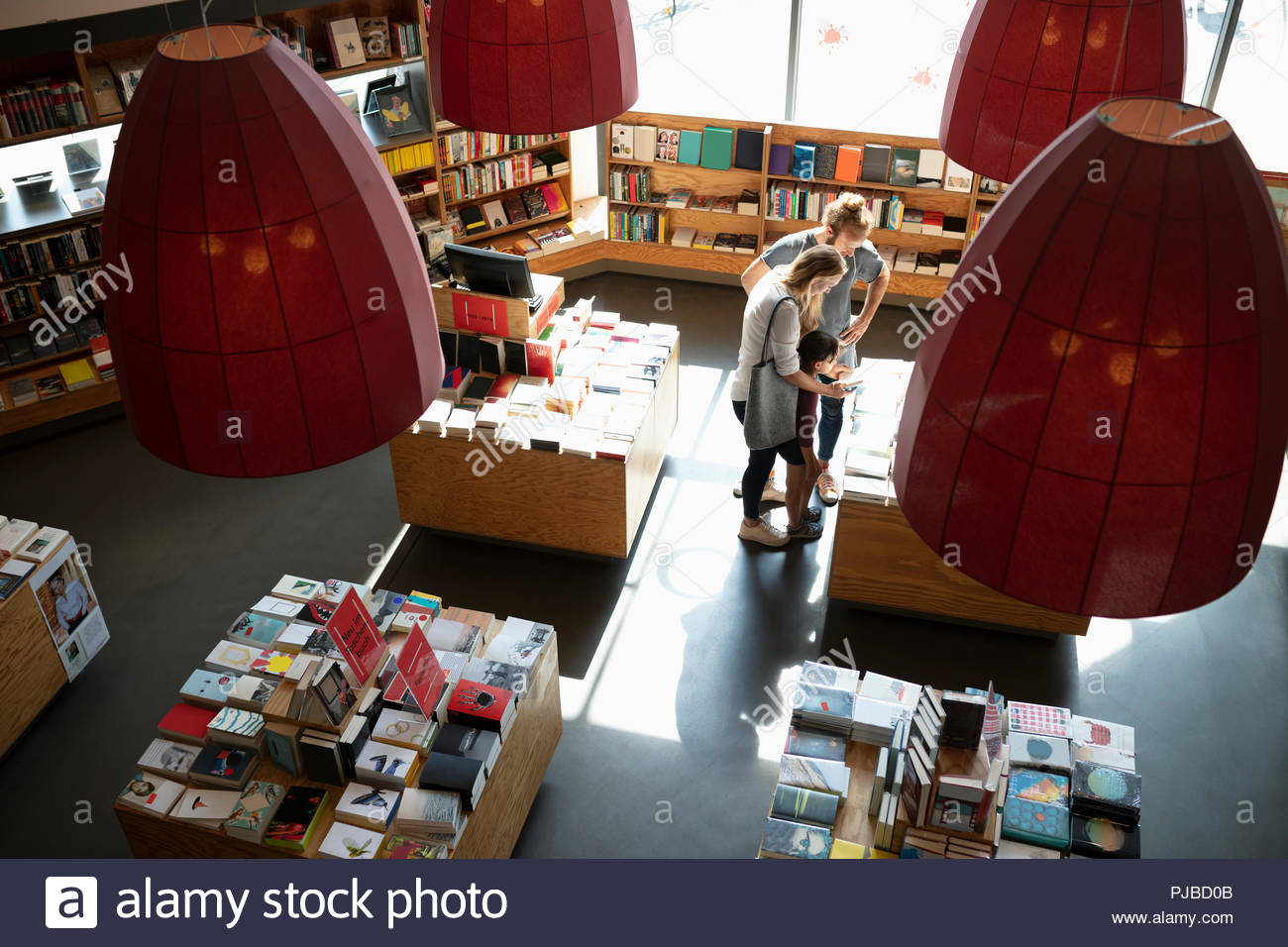 Woman Reading In Book Store High Resolution Stock Photography and ...