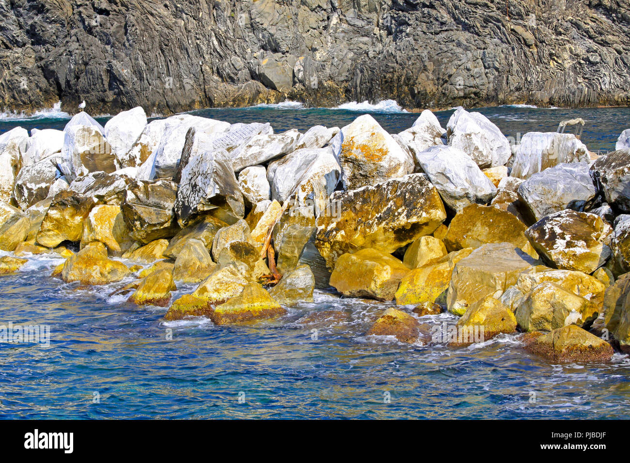 Sea wall stones for coastal flood defence Stock Photo - Alamy