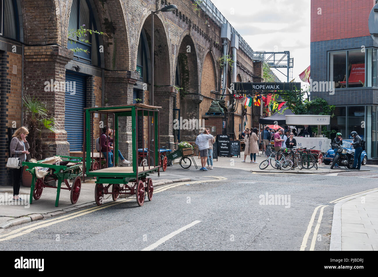 Saturday morning scene of the food market in Maltby Street, London ...