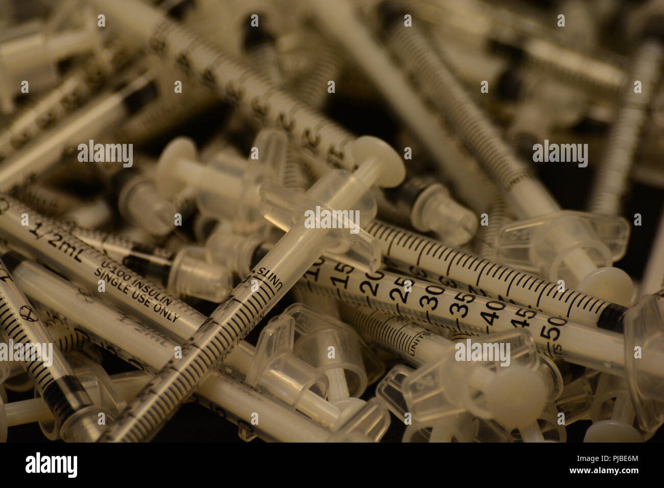 Used syringes in a pile Stock Photo - Alamy