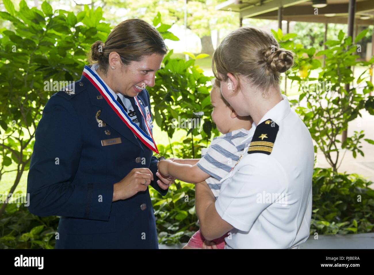 Makai Agha, of Kailua, Hawaii, and his mother, U.S. Navy Lt. Kelly Agha ...