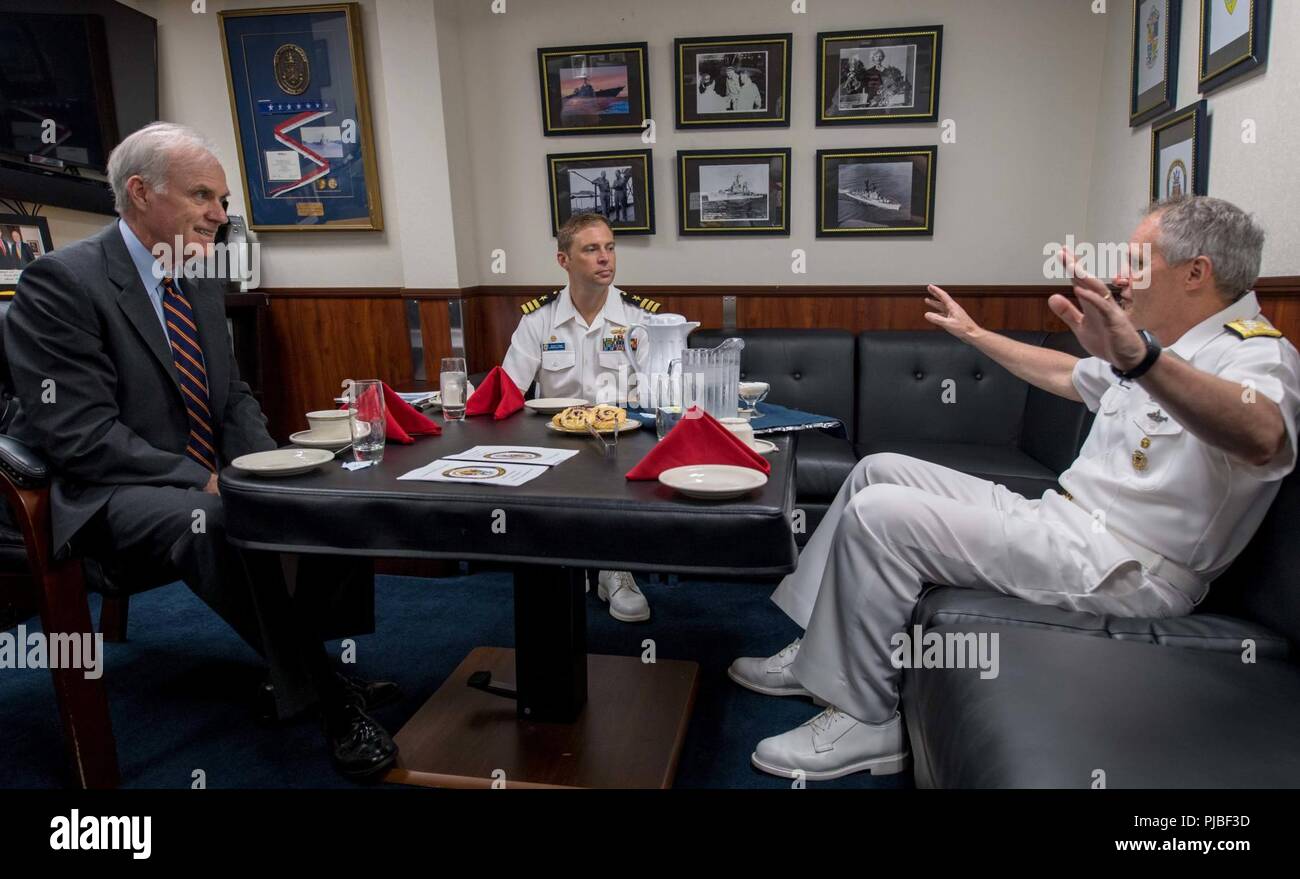 Secretary of the Navy Richard V. Spencer speaks with Vice Adm. Phillip ...