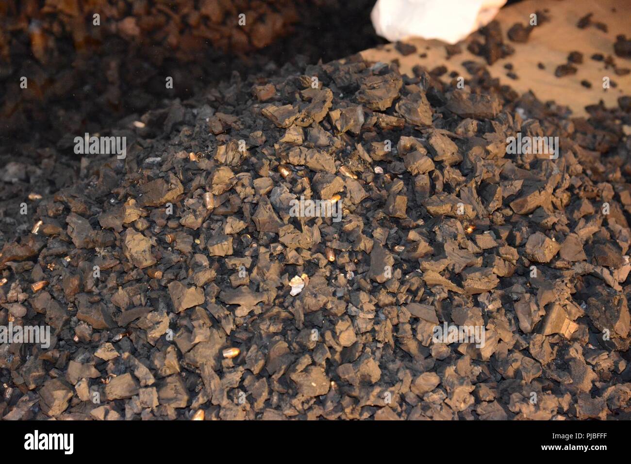 Contractors (not pictured) bring down a mix of rubber granular and lead ...