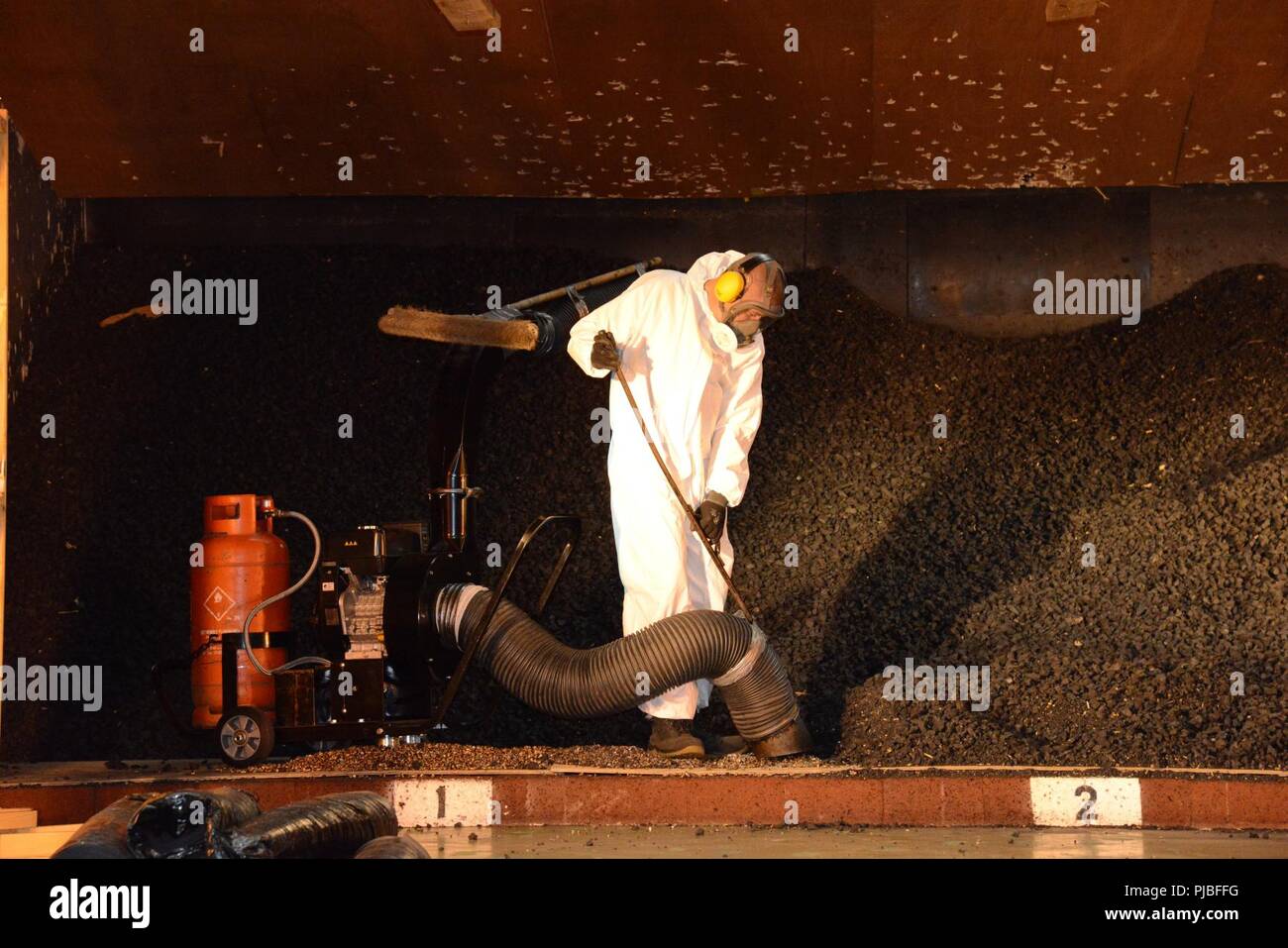 A contractor uses a vacuum to separate rubber granular and lead bullets ...