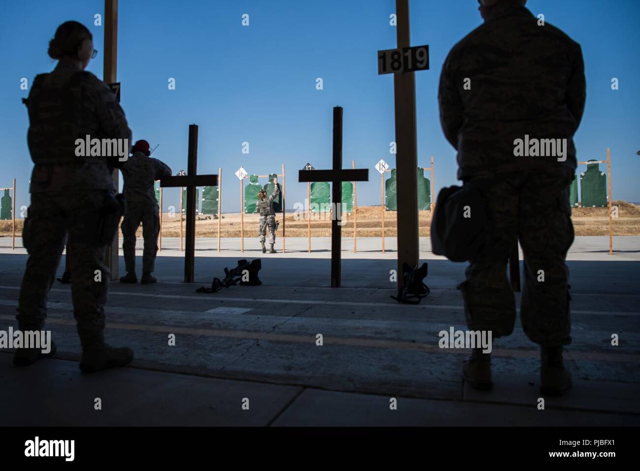 A Combat Arms Training and Maintenance (CATM) class student secures her ...