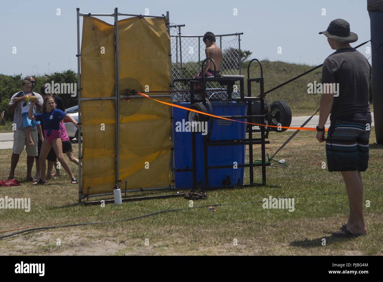 Children participate in the dunk tank during a Beach Bash held by the ...