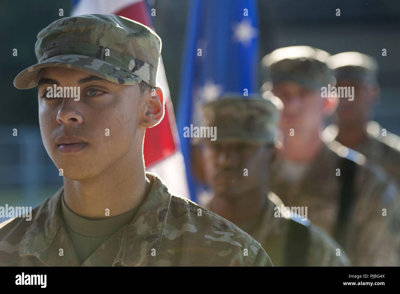 Airmen from the 820th Base Defense Group (BDG) color guard prepare to ...