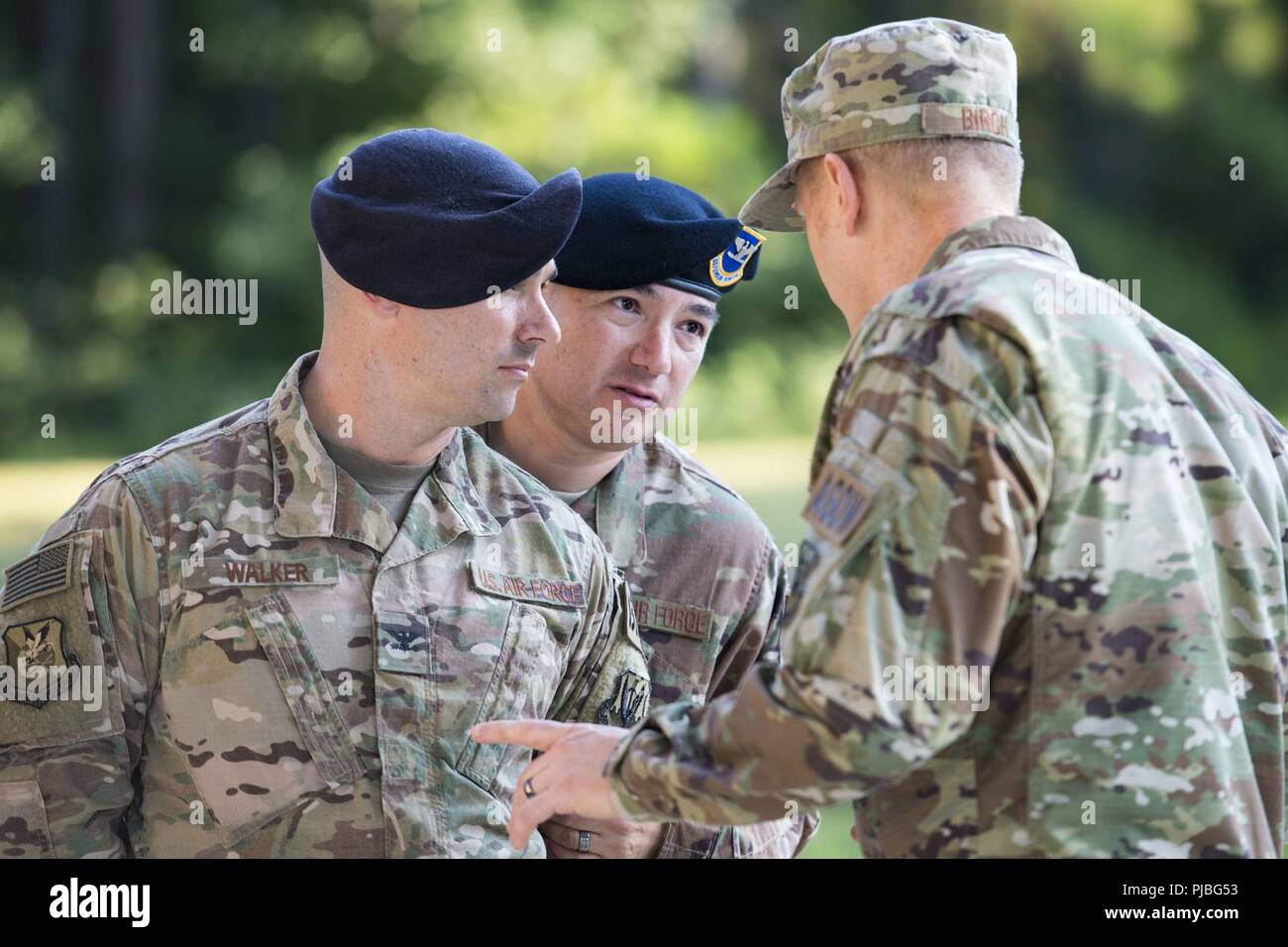 Leadership from the 93d Air Ground Operations Wing (AGOW) gather during ...