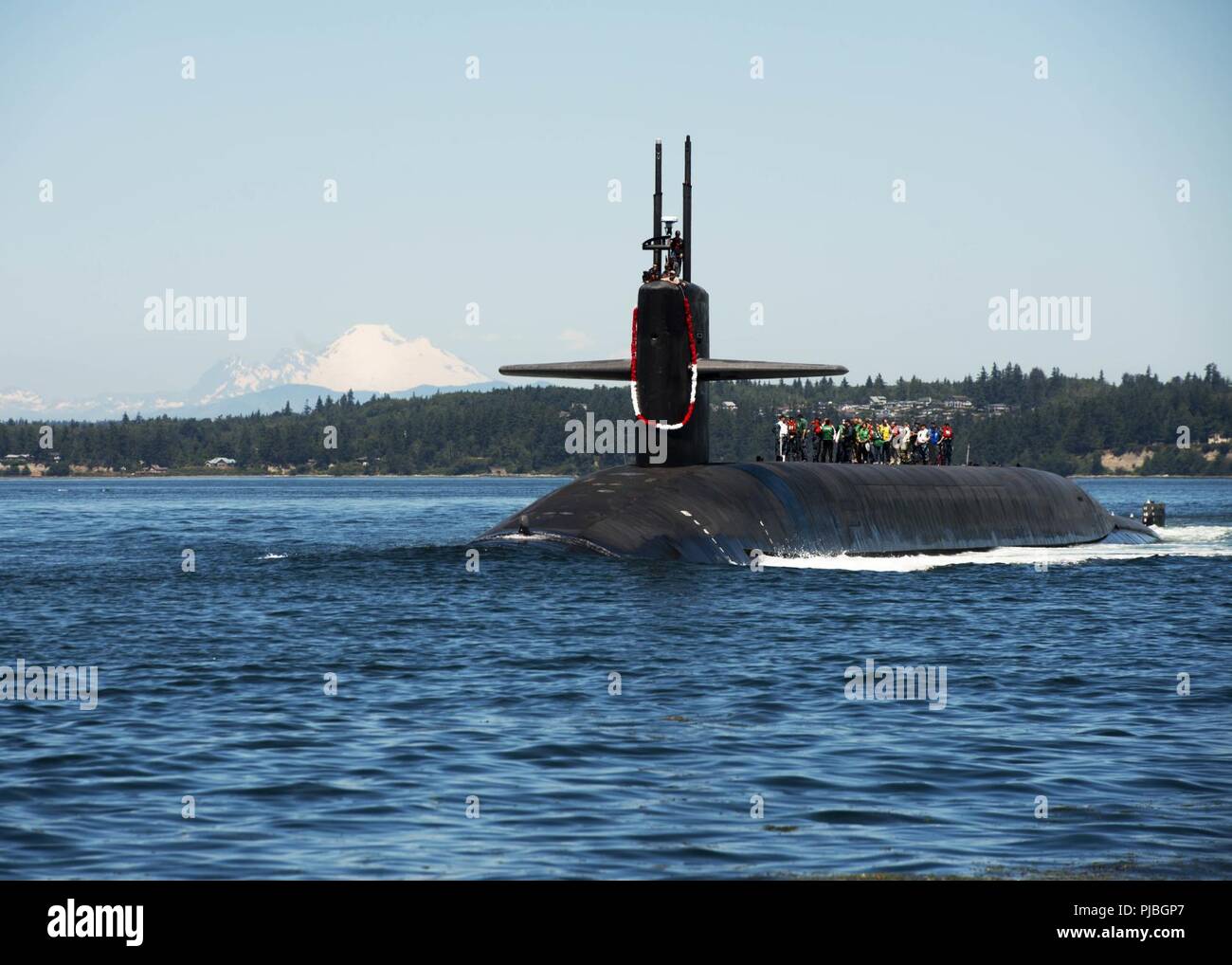 PUGET SOUND, Wash. (July 12, 2018) Members of the Big Red Sub Club ride ...