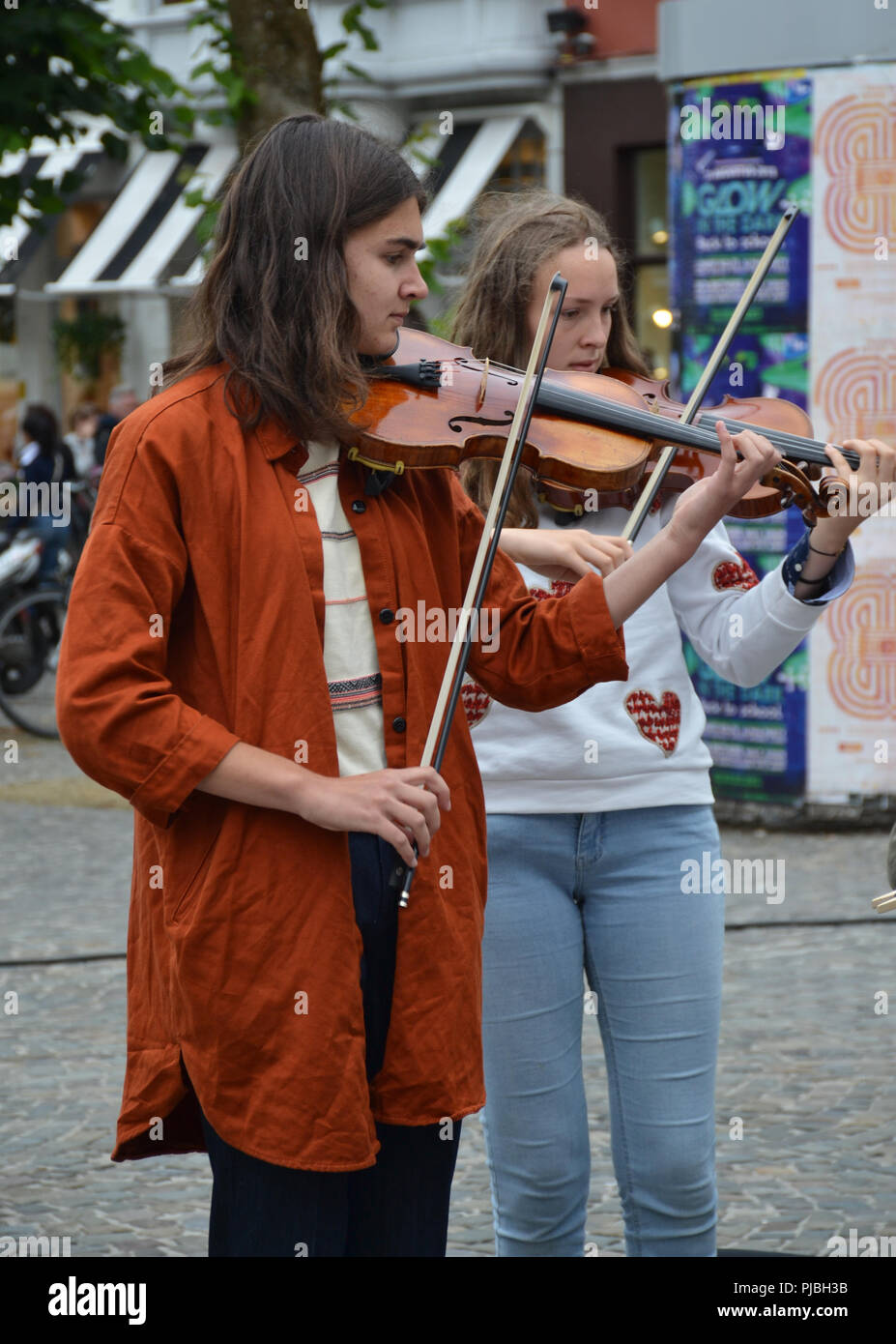 Bruges, Belgium - August 25, 2018: Group of street musicians playing in ...