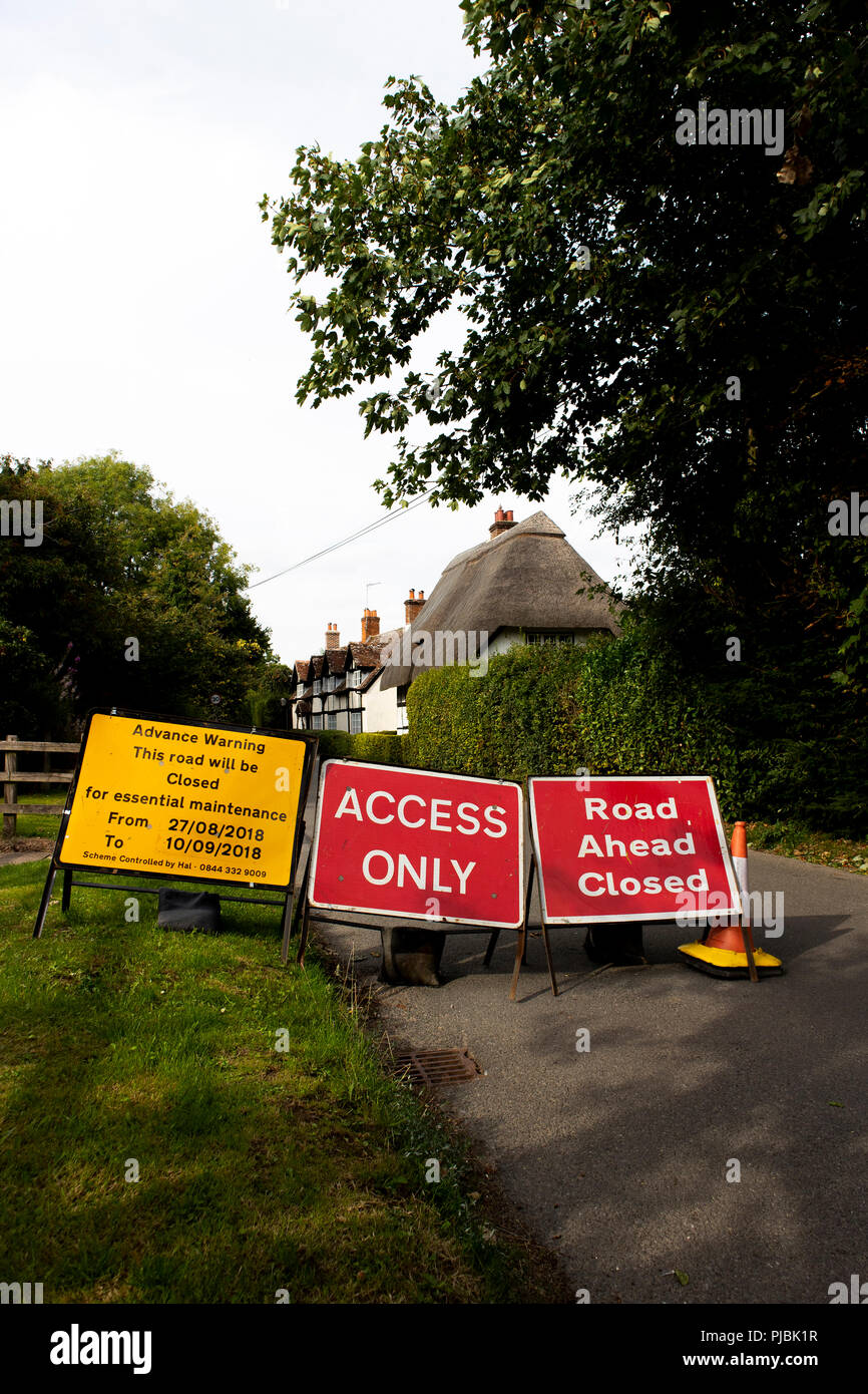 rural road through village closed for essential maintenance signs Stock ...