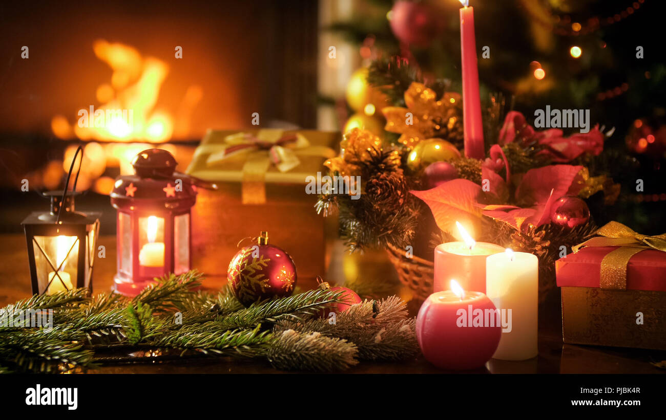 Closeup toned image of Christmas decorations on wooden table against ...