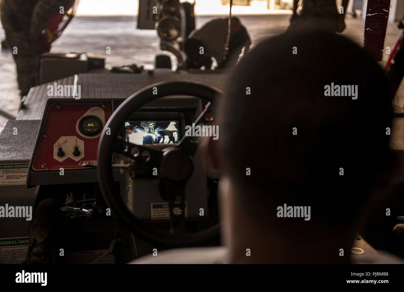 An Airman from the 18th Aircraft Maintenance Squadron, drives an ...