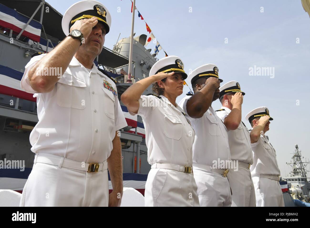 MANAMA, Bahrain (July 11, 2018) Officers salute during a change of ...