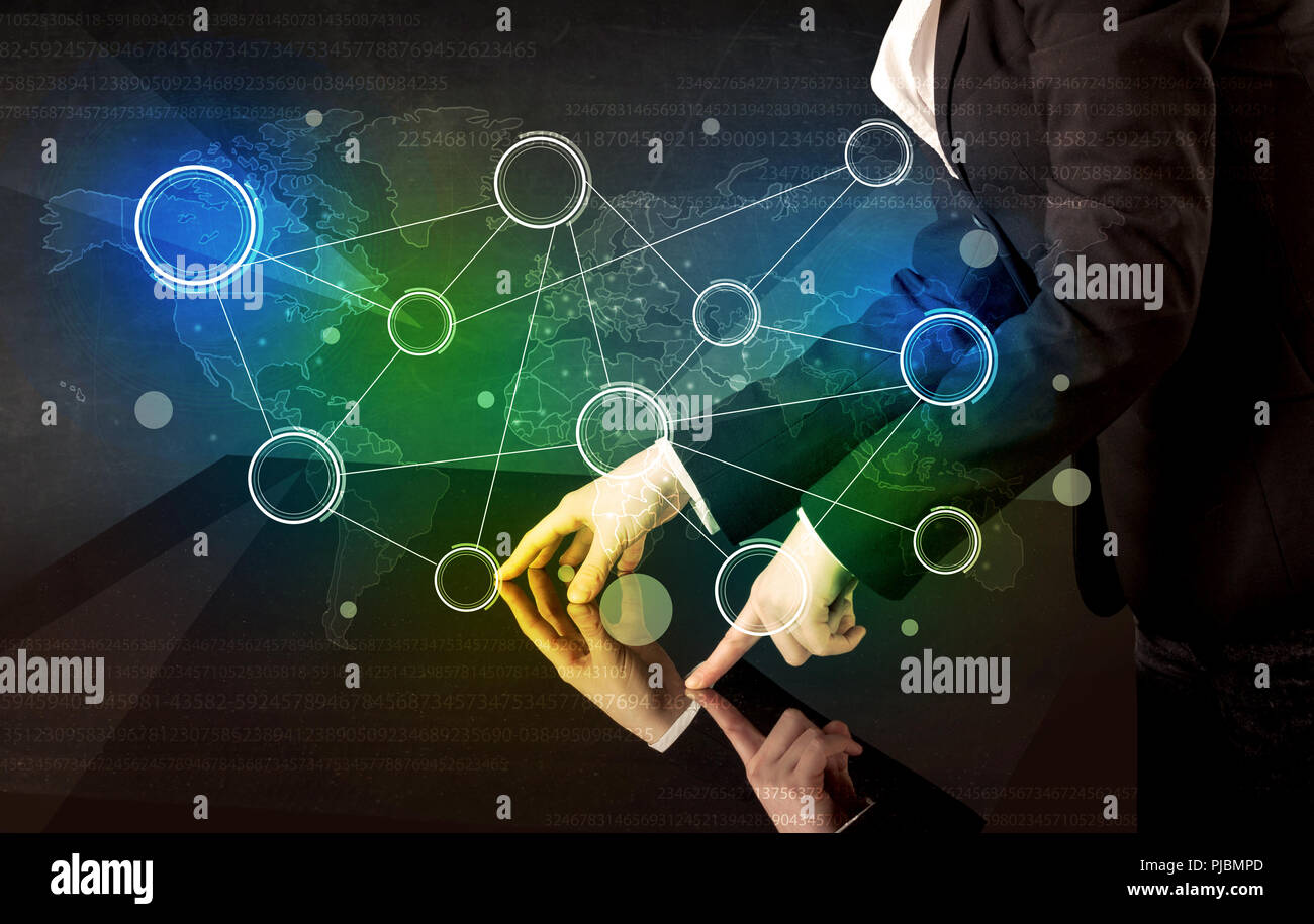 Male hands touching interactive table with colorful world map on it ...