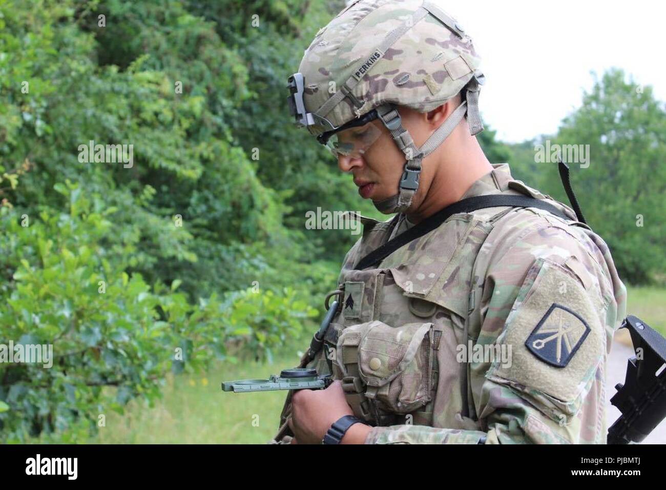 Sgt. Xavier Perkins, 16th Sustainment Brigade, checks his compass to ...