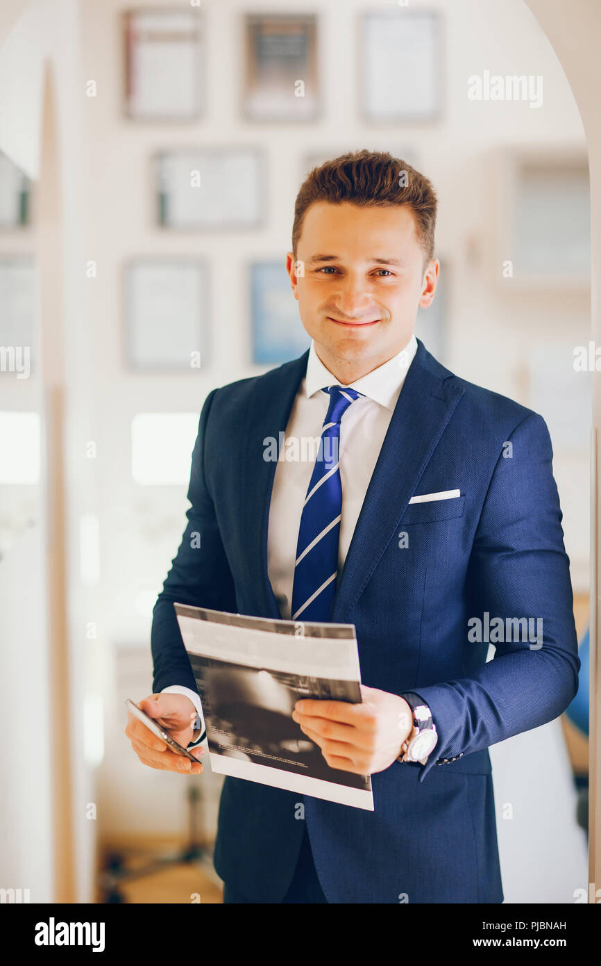 Successful man in suit stands hi-res stock photography and images - Alamy