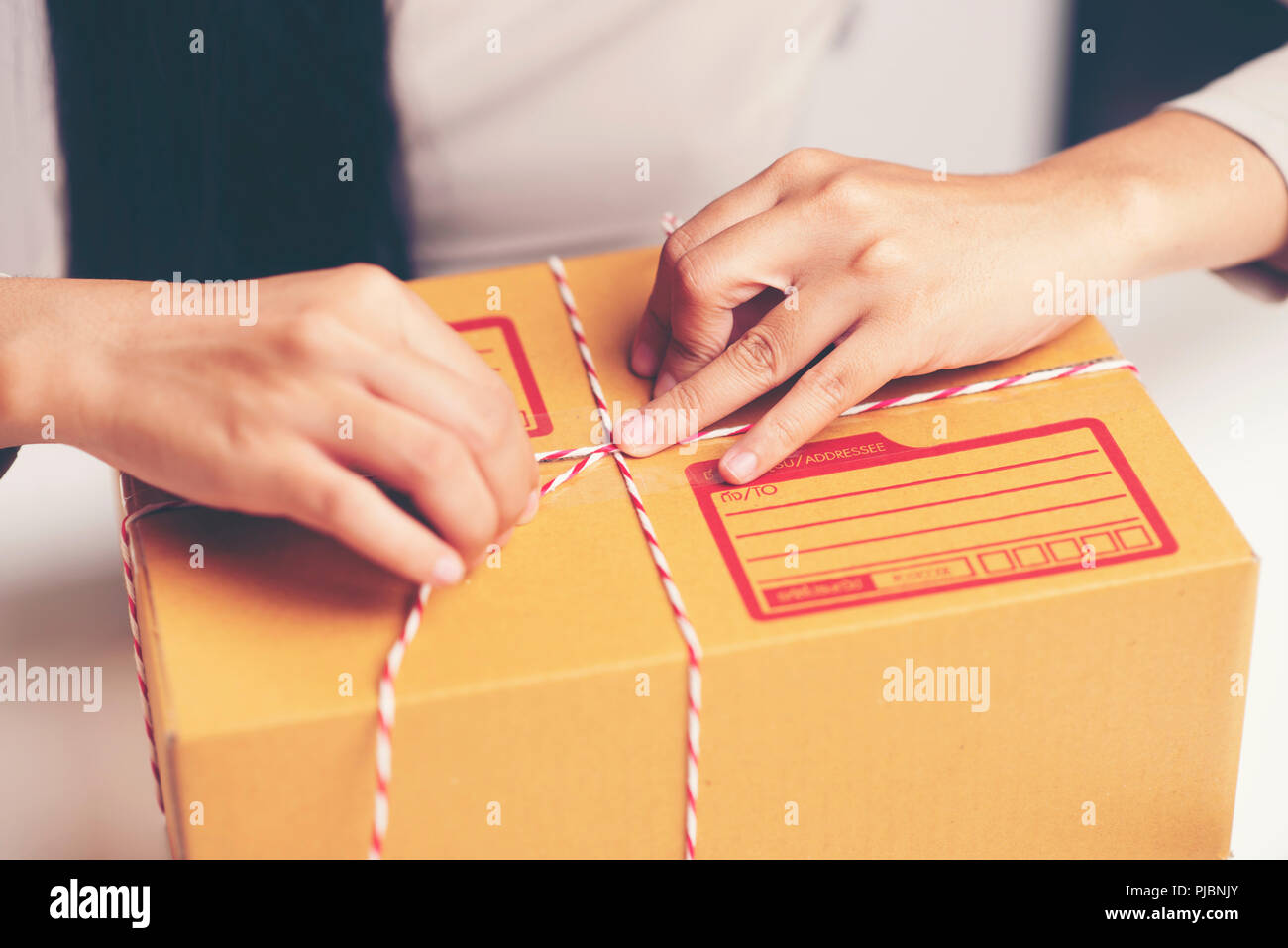 Female hands packing box at warehouse, online marketing concept Stock ...