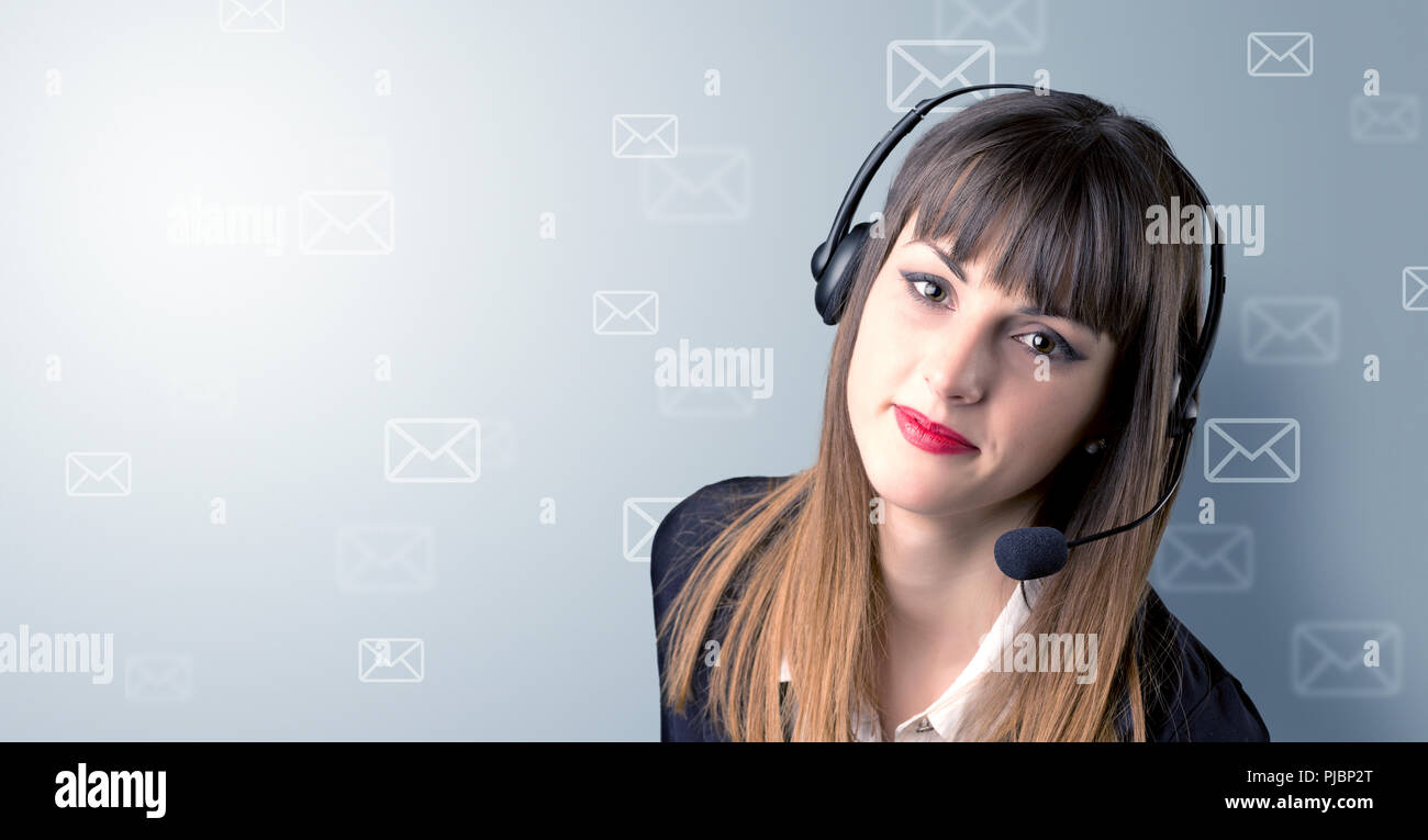 Young female telemarketer with white envelopes surrounding her Stock ...