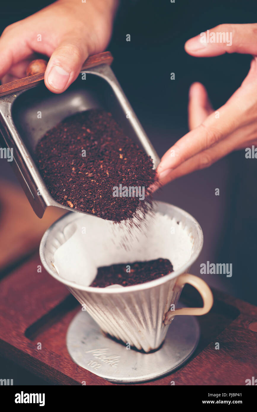 Making brewed coffee from steaming filter drip style Stock Photo - Alamy