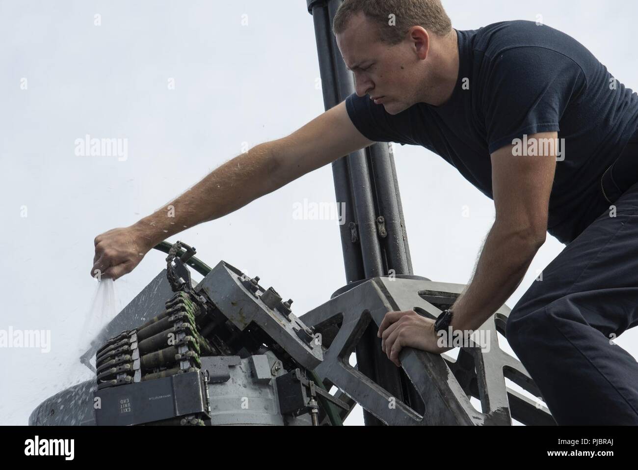 At Sea (July 14, 2018) Fire Controlman 1st Class Andrew Wilkins cleans ...