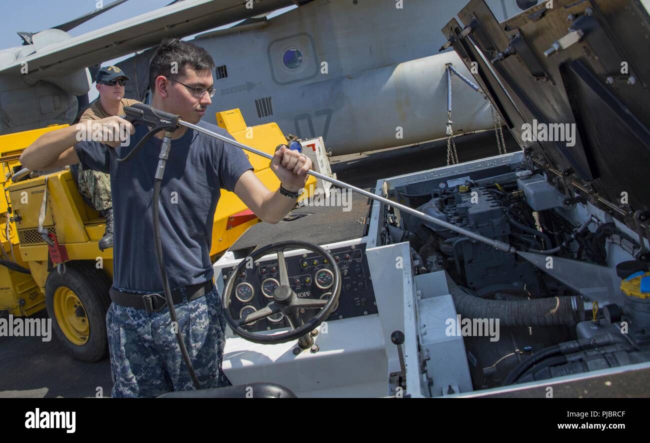 Us navy flight deck tractor hi-res stock photography and images - Alamy