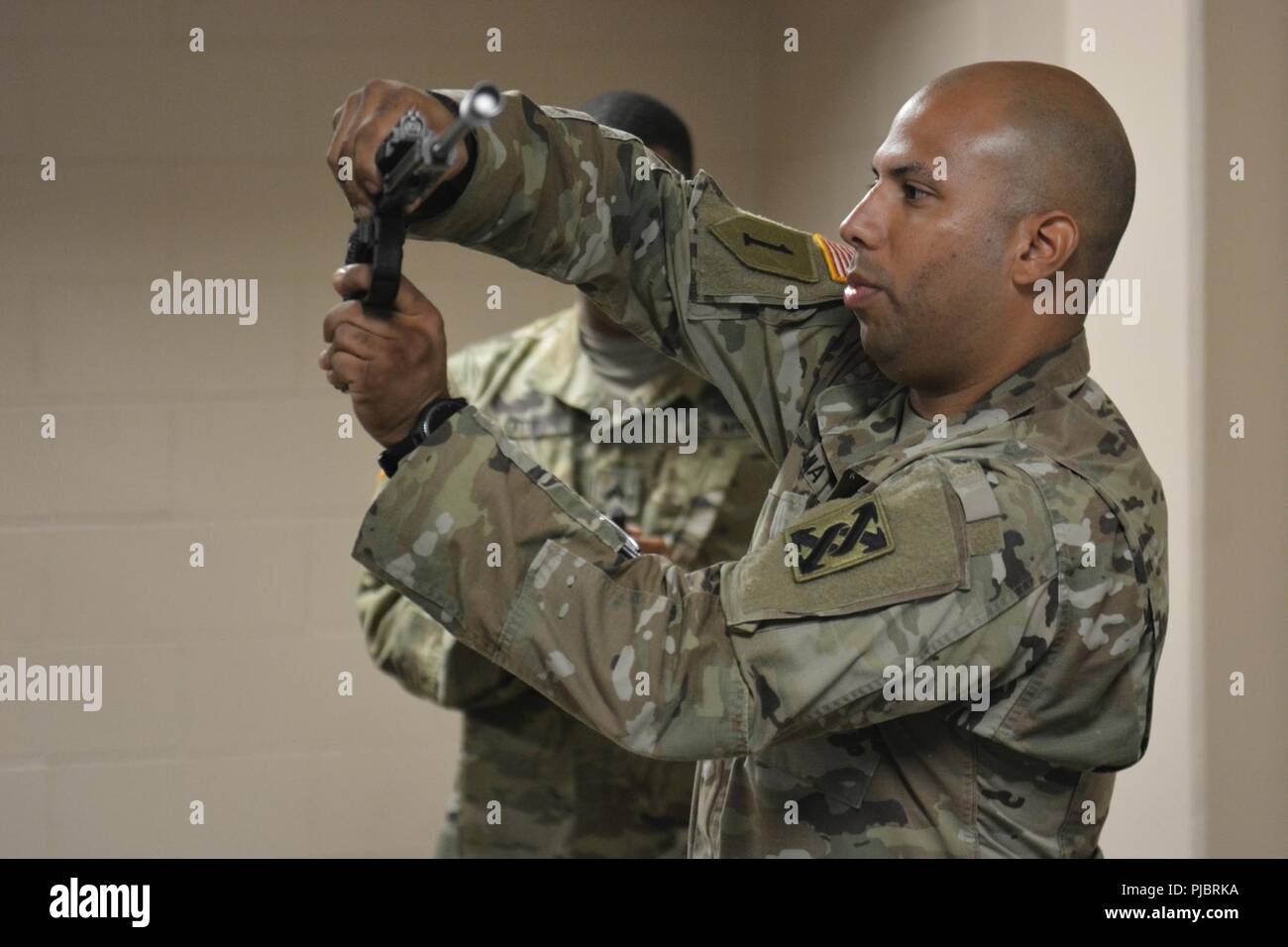 U.S. Army Reserve Sgt. Josh Pena, preliminary marksmanship instructor ...