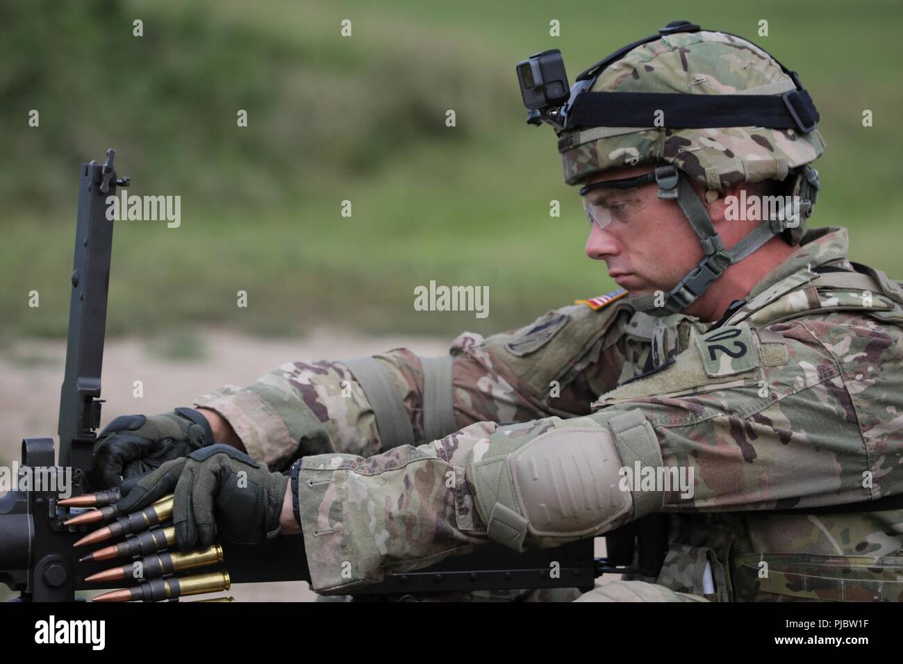 Navy loads 50 caliber machine gun hi-res stock photography and images ...