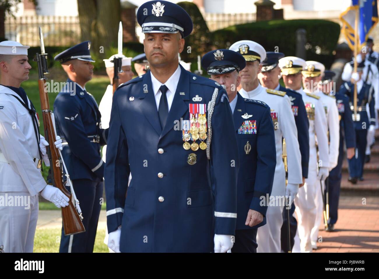 U.S. Air Force Honor guard Commander Lt. Col. Jason C. Harris escorts ...