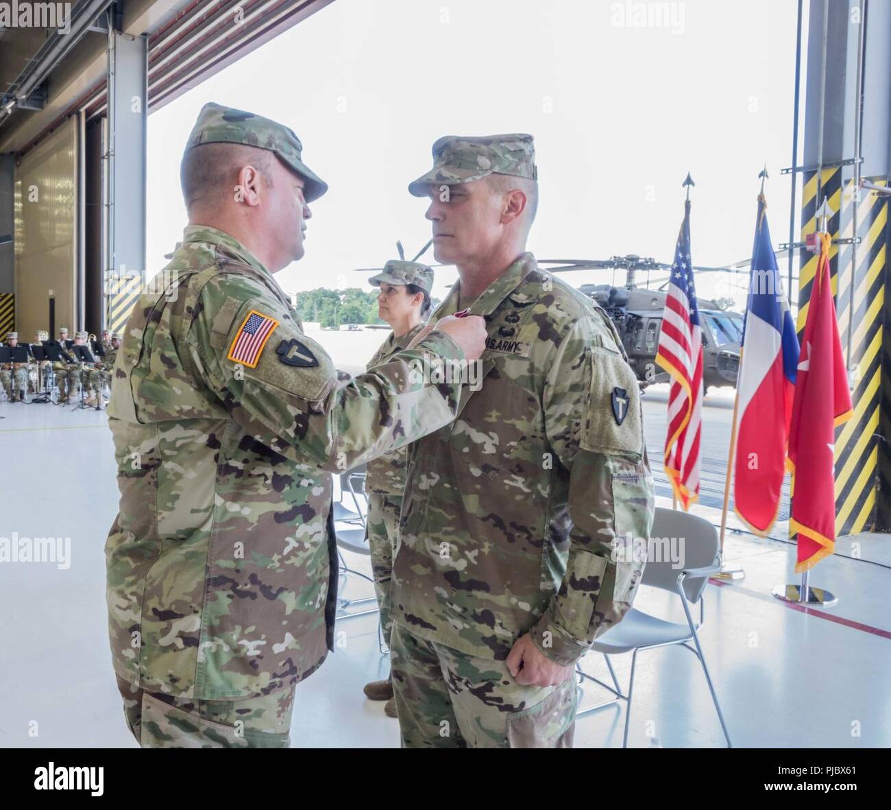 Maj. Gen. Samuel L. Henry, commander, 36th Infantry Division, presents ...