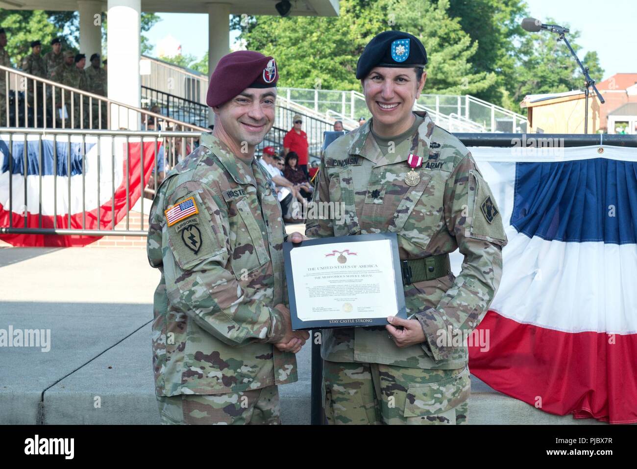 Colonel Mark Hoffmeister presents LTC Estee Pinchasin with the ...