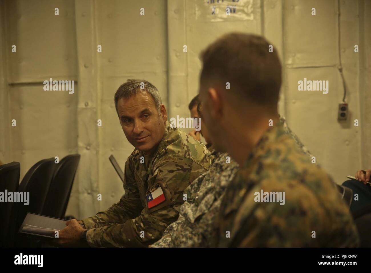 Chilean Navy Capt. Jorge Keitel, left, a special advisor with Special ...