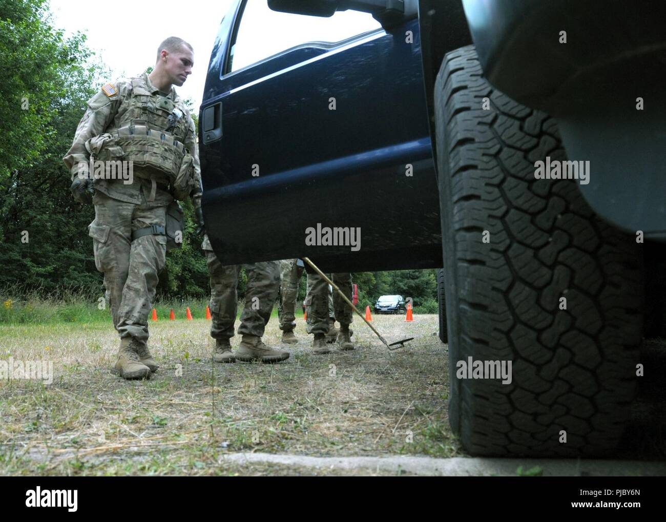Spc. Brian Mooney, assigned to 18th Military Police Brigade, leads a ...