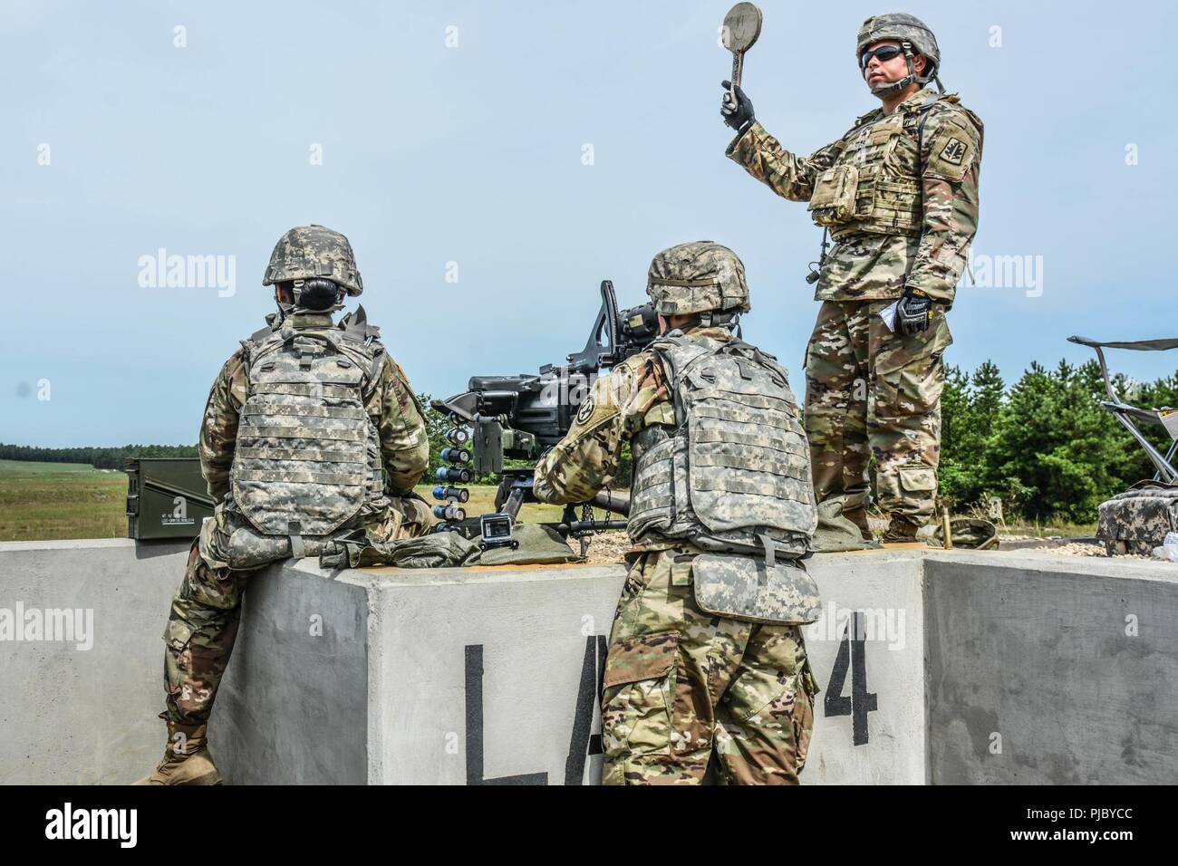 A U.S. Army Reserve Task Force Ultimate cadre member signals the tower ...