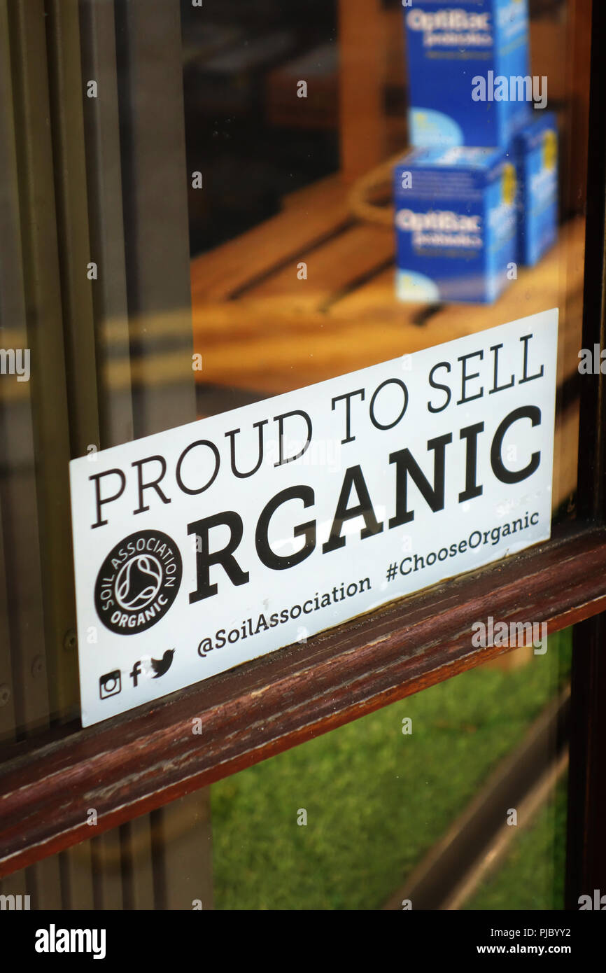 Proud to sell Organic products window sticker in a window display in ...